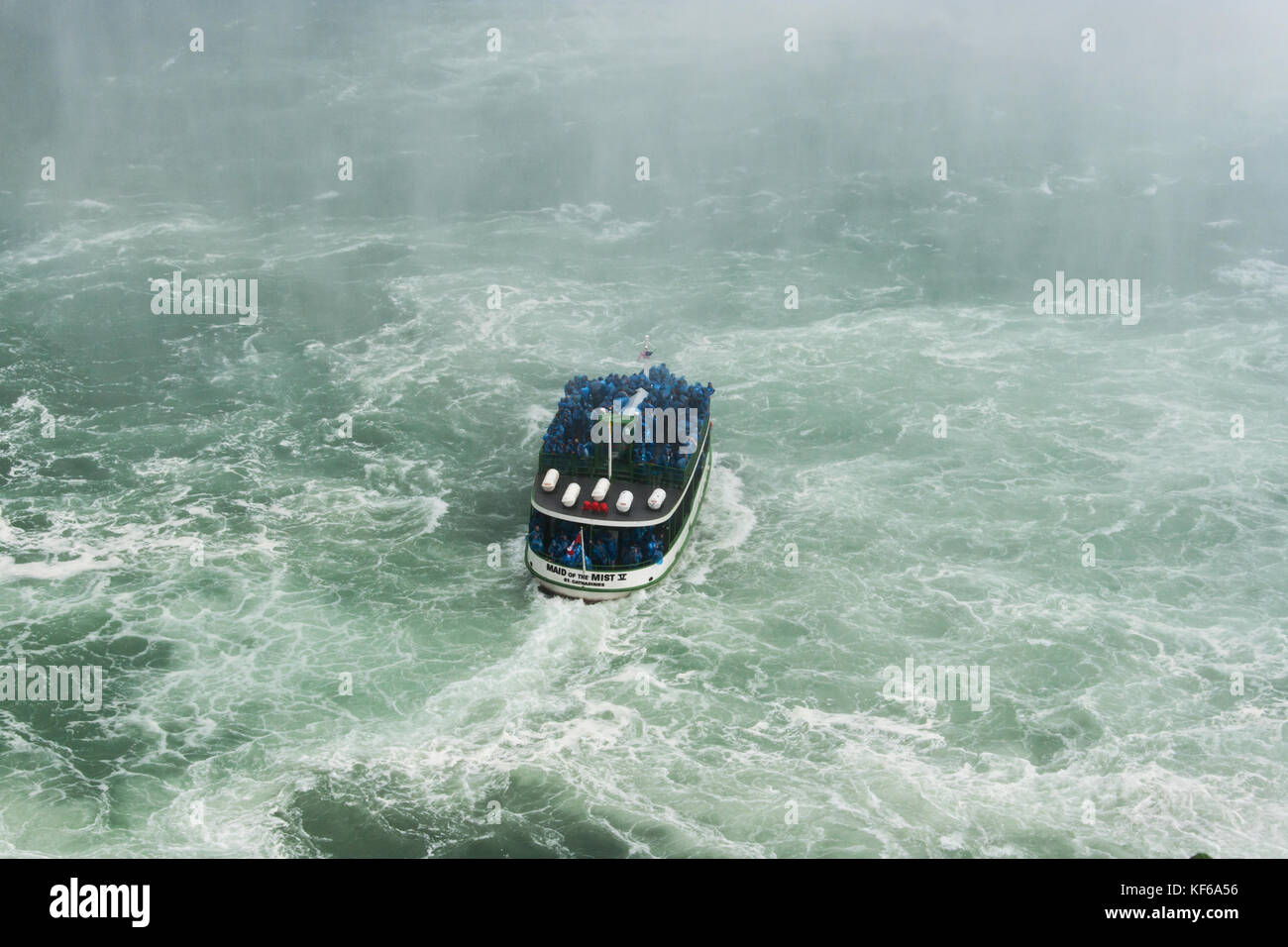 Mist boat with tourists on Niagara Falls Stock Photo - Alamy