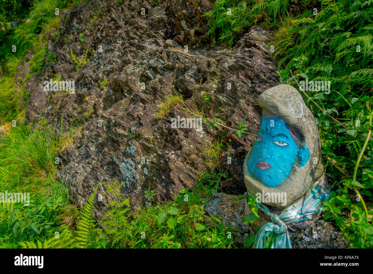POKHARA, NEPAL - NOVEMBER 04, 2017: Close up a rock painted with color ...