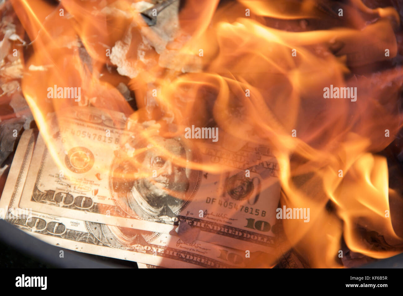 Burning one hundred dollar bill hi-res stock photography and images - Alamy
