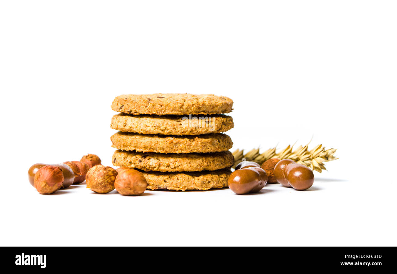 Integral cookies with hazelnuts isolated on white Stock Photo - Alamy