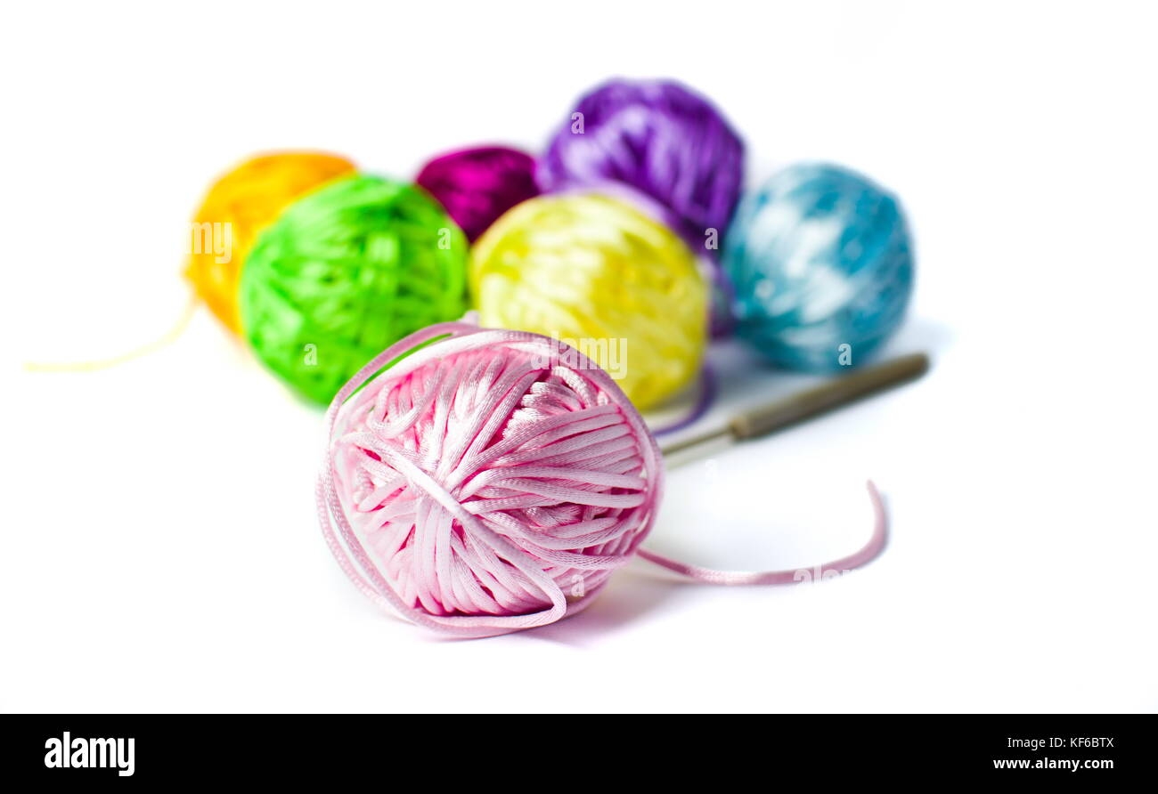 Colorful crocheting thread balls and needle isolated on white Stock ...