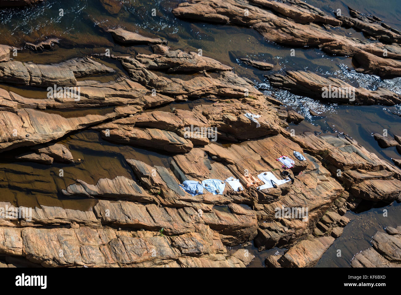 Wash clothes on rock hi-res stock photography and images - Alamy