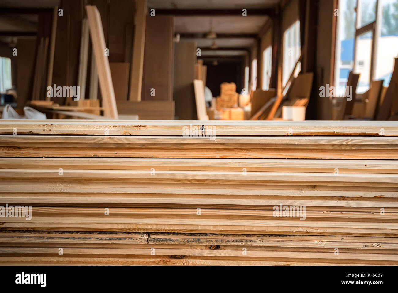 Inside woodworking workshop with lumber in front Stock Photo - Alamy