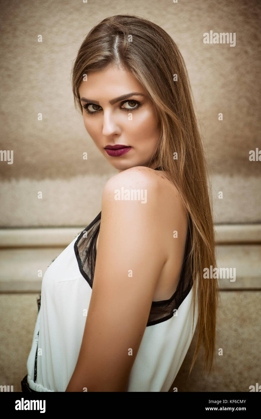 Serious young woman staring outdoors Stock Photo - Alamy