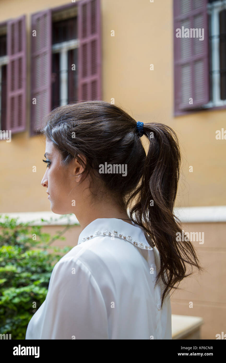 Rear view young woman ponytail hi-res stock photography and images - Alamy
