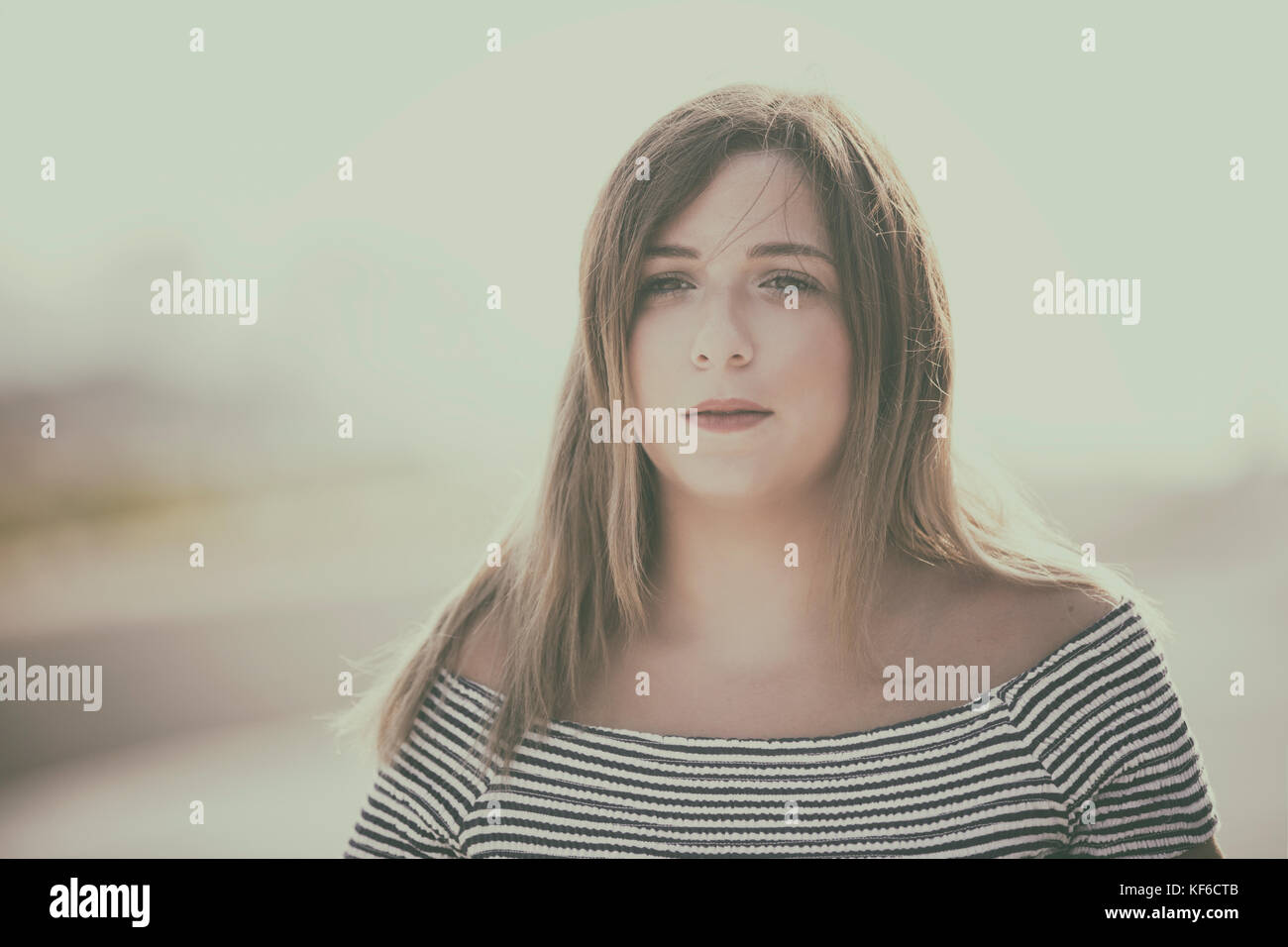 Beautiful young woman thinking outdoors Stock Photo - Alamy Beautiful young woman thinking outdoors Stock Photo - Alamy