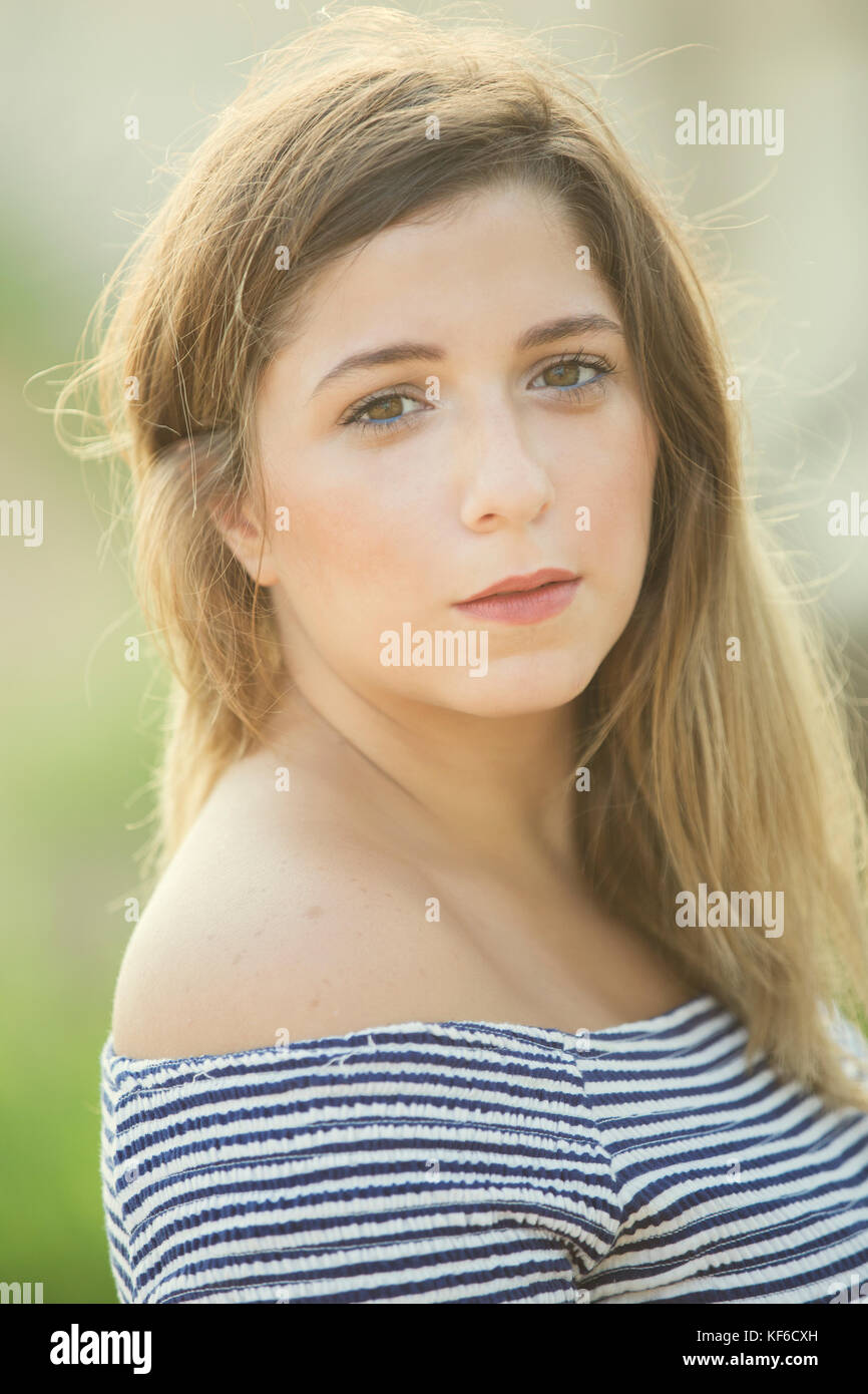 Serious beautiful young woman outdoors Stock Photo - Alamy