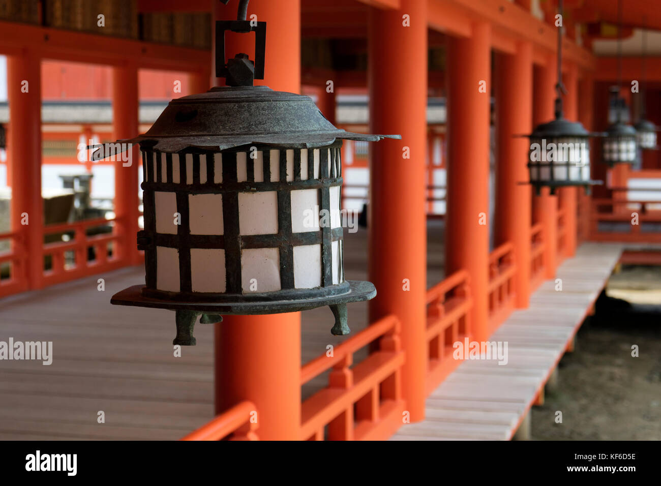 Miyajima - Japan, May 26, 2017: Black lanterns and red pillars at the ...