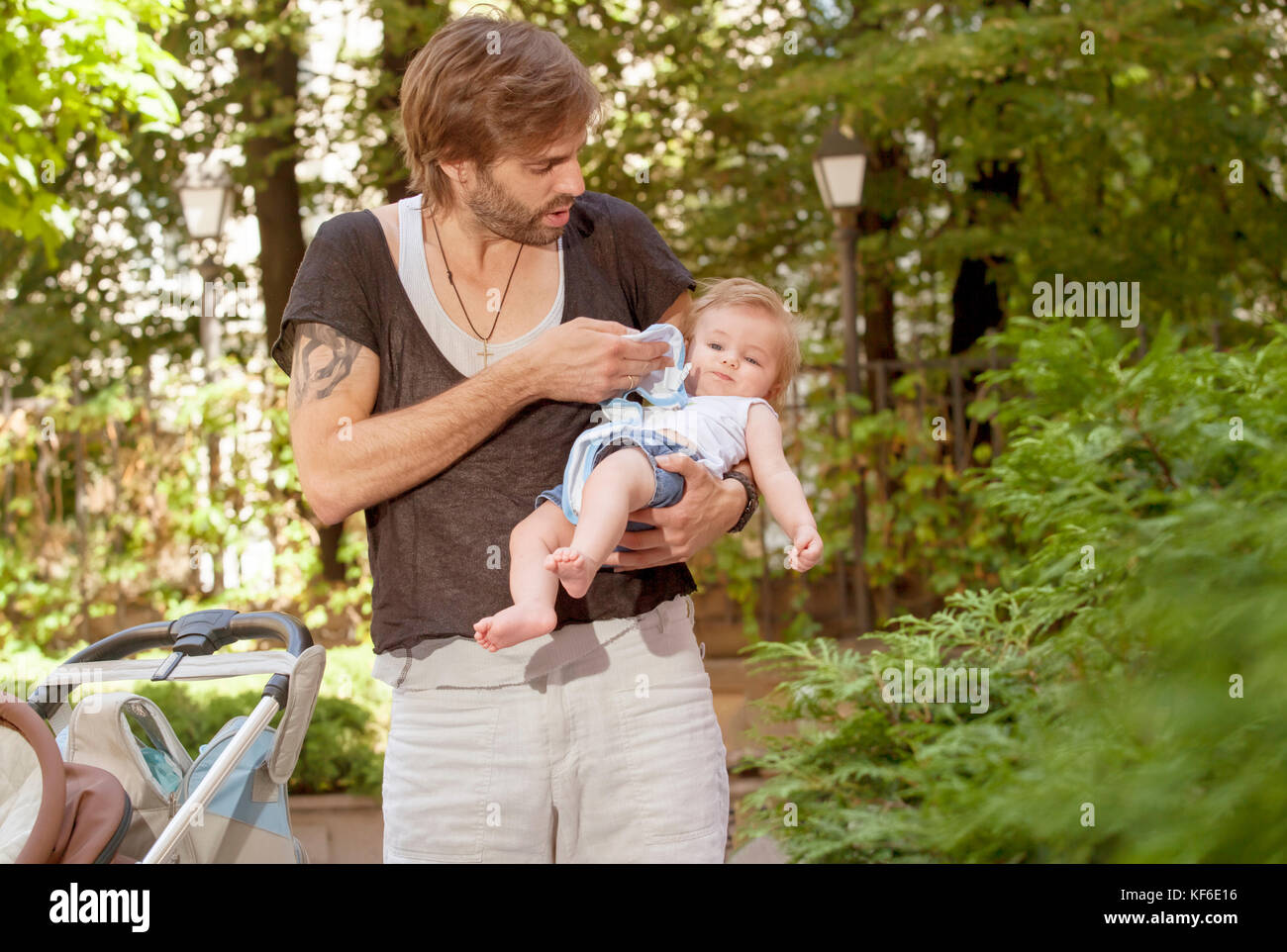 Father Taking Care Of A Baby High Resolution Stock Photography and ...