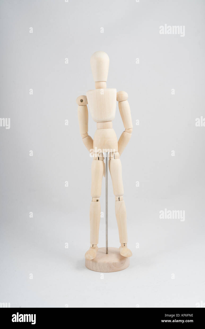 a wooden dummy posing with arms in front Stock Photo - Alamy