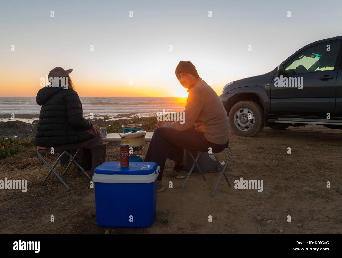 Friends together at sunset Stock Photo - Alamy