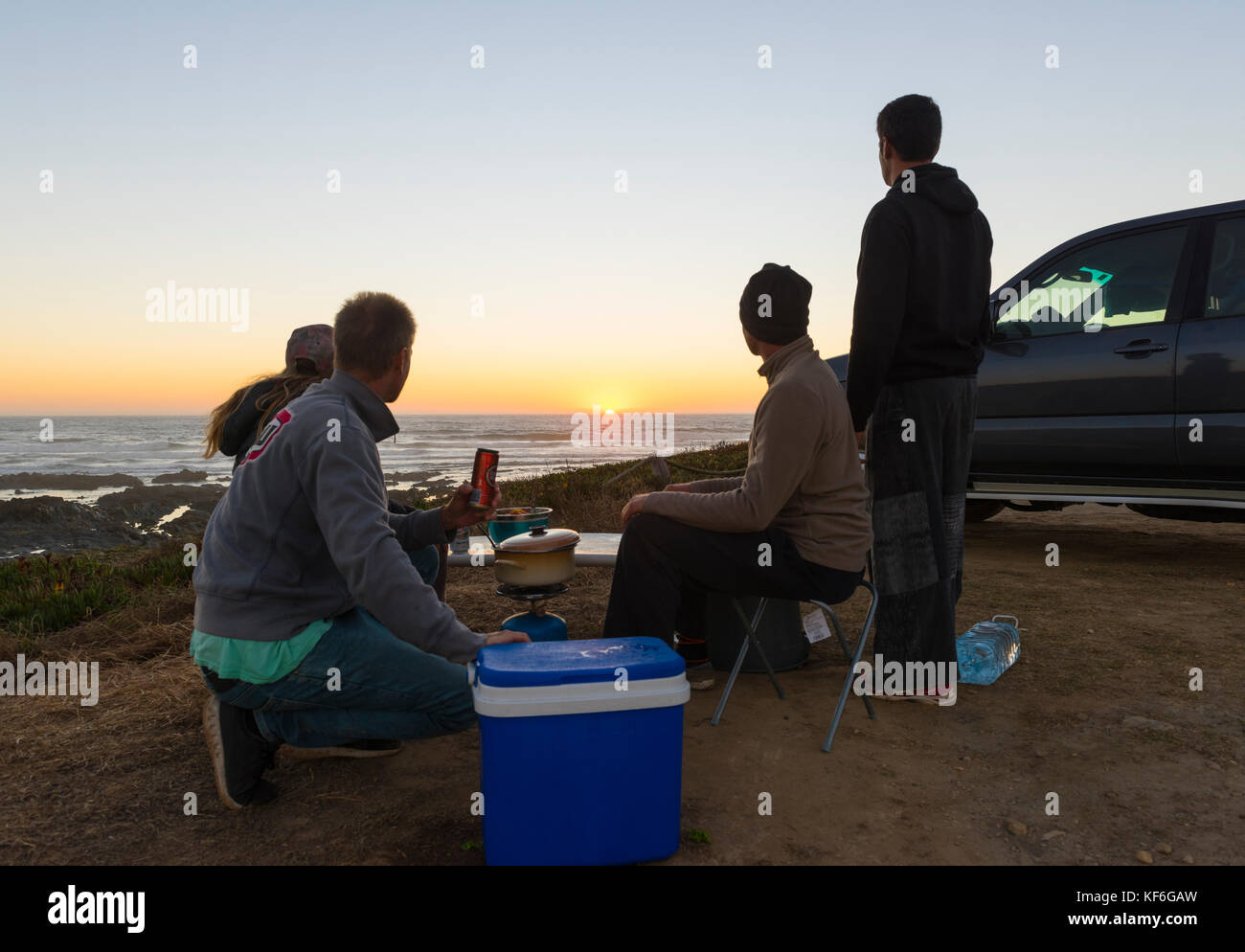 Friends together at sunset Stock Photo - Alamy