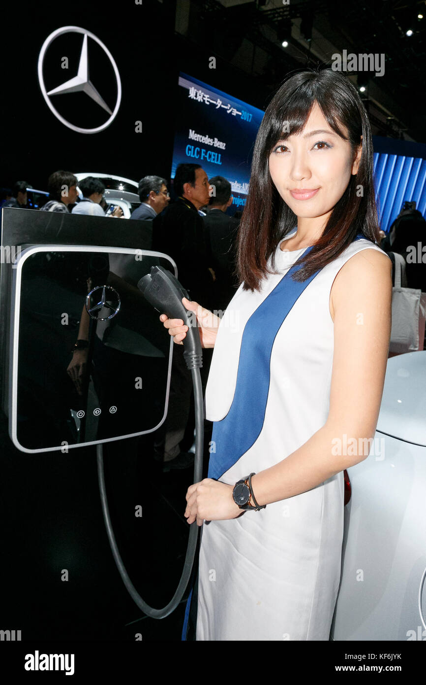 A booth assistant poses for a photograph during the 45th Tokyo Motor ...