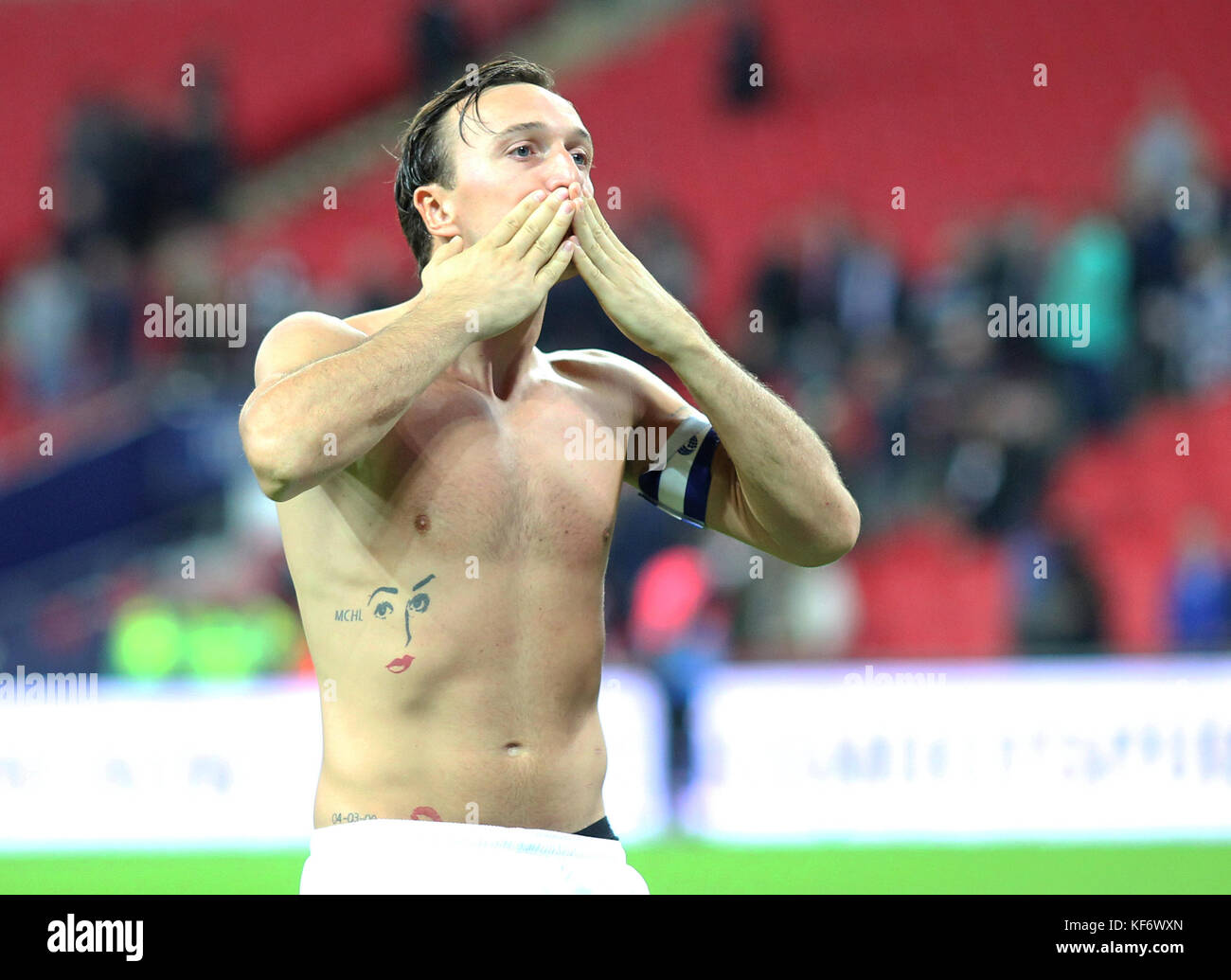 London, UK. 25th October 2017. Mark Noble shirtless of West Ham United ...