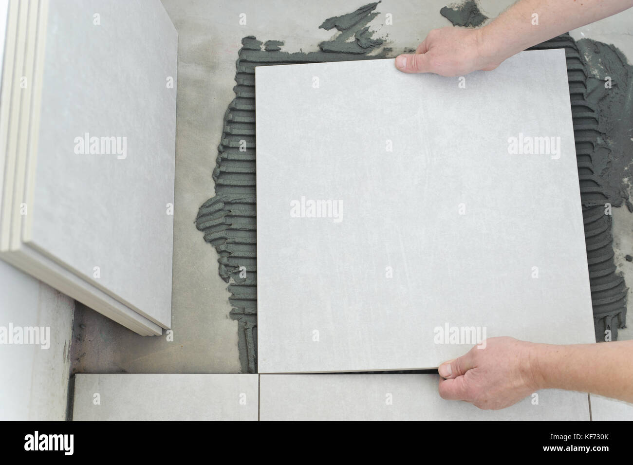 Installing floor tile hi-res stock photography and images - Alamy