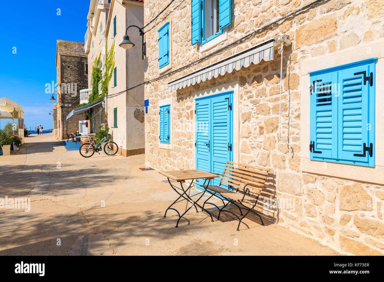 Street with traditional coastal restaurants in old town of Primosten ...