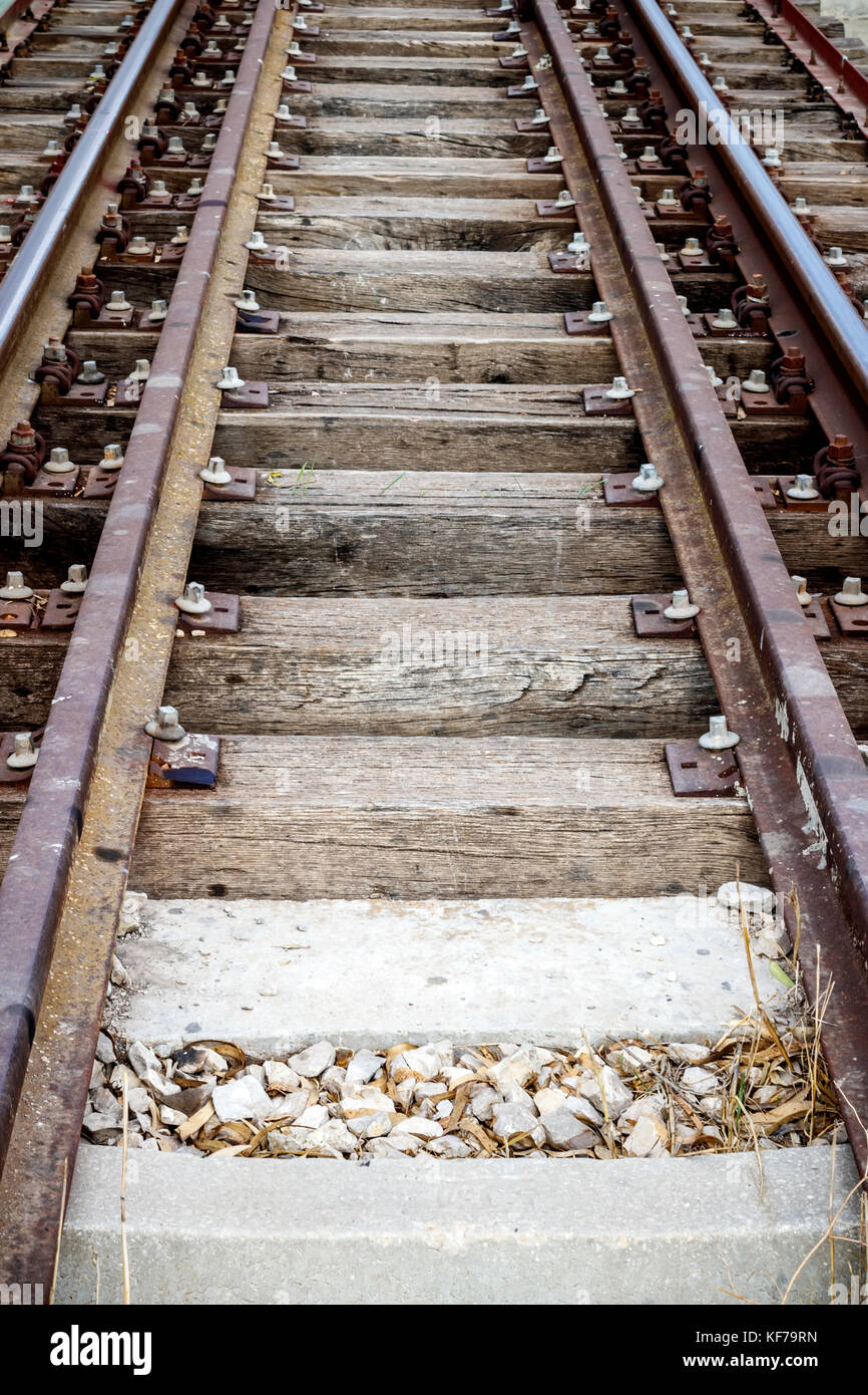 The rails on wooden or concrete sleepers Stock Photo - Alamy