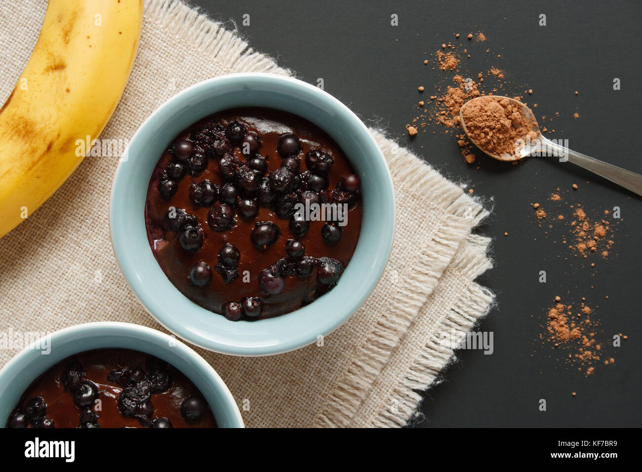 Chocolate pudding with blueberries in ramekins top view Stock Photo - Alamy