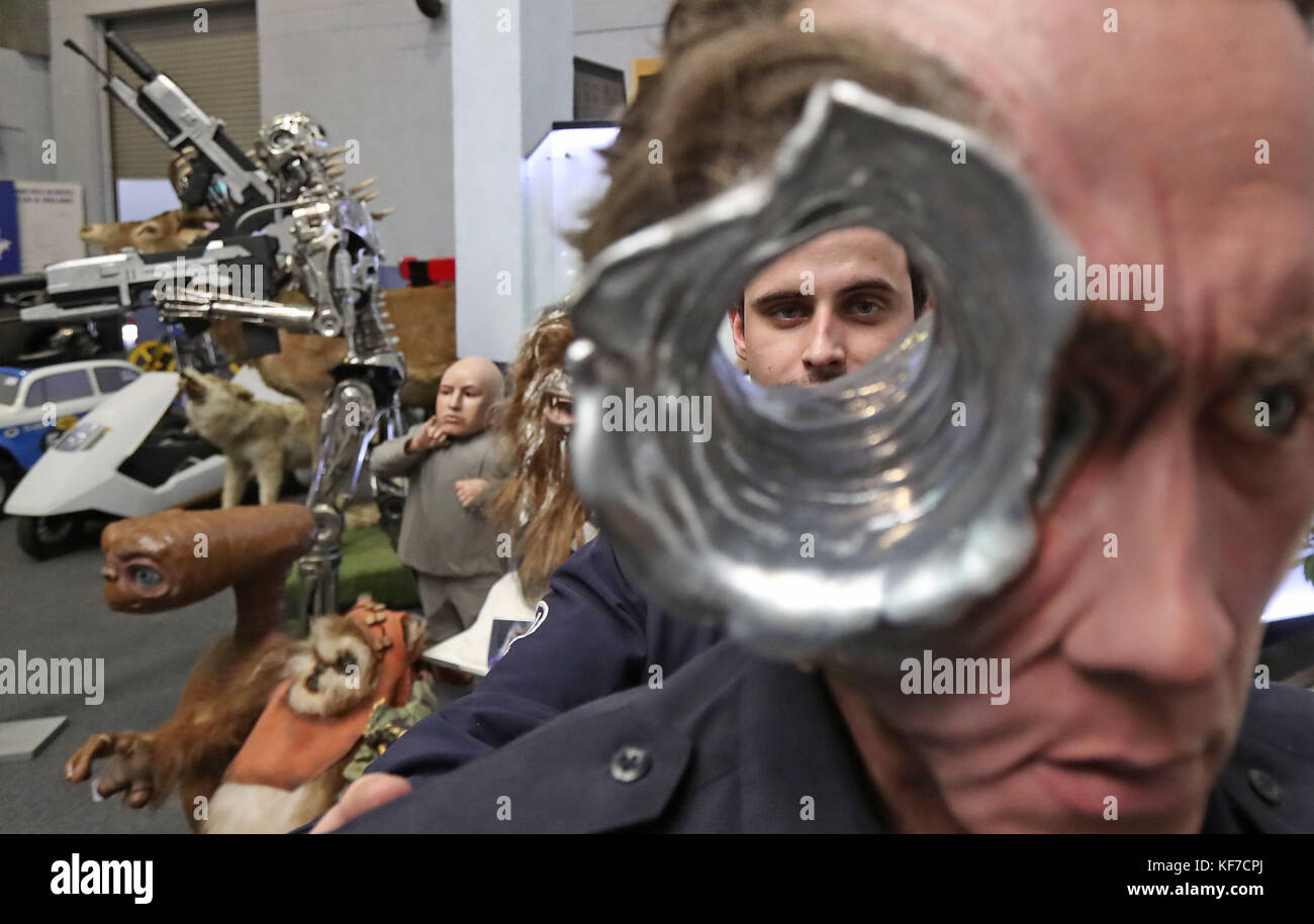Reece Morrison of Wilsons Auctions helps display hundreds of items of ...