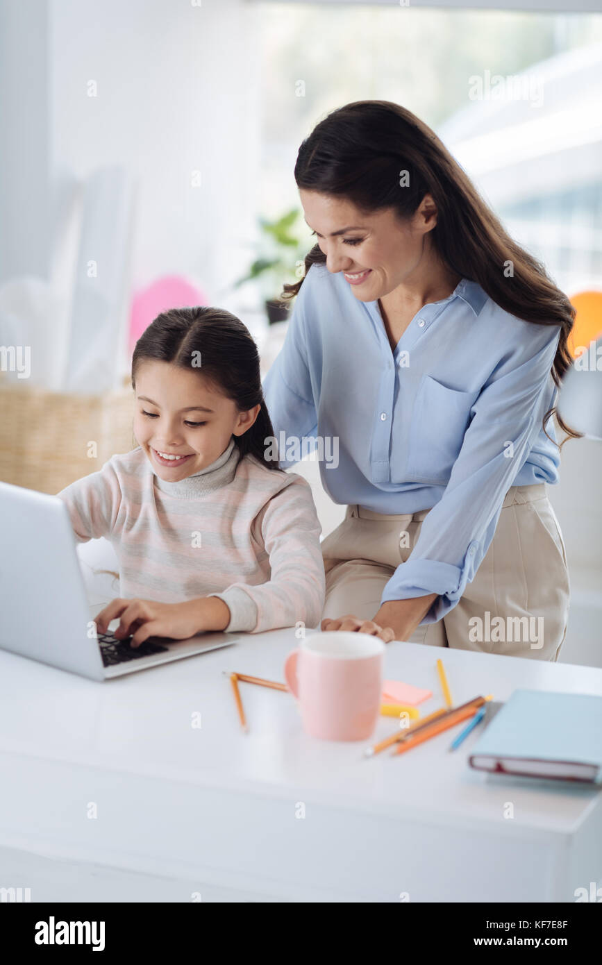 Positive smart girl typing on the laptop Stock Photo - Alamy