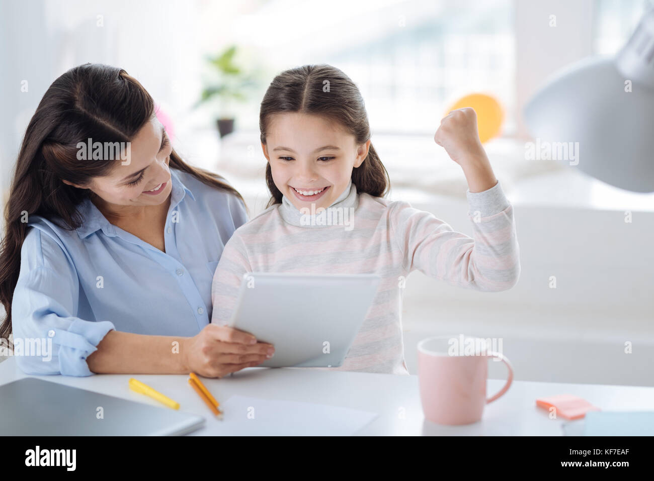 Delighted positive girl being happy Stock Photo - Alamy