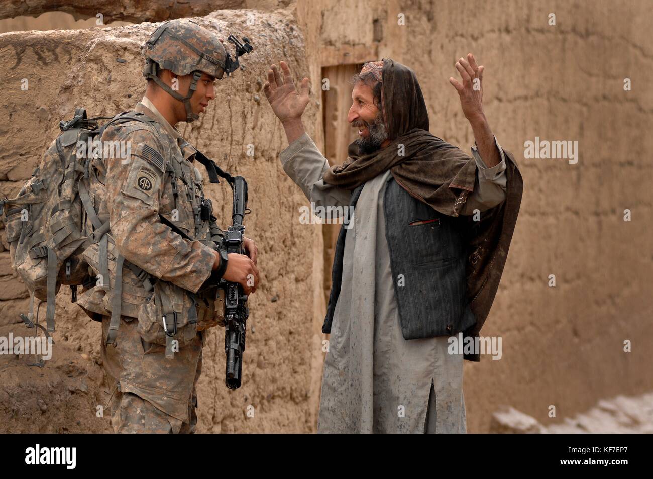 A U.S. Army soldier speaks with a Afghan villager during Operation ...