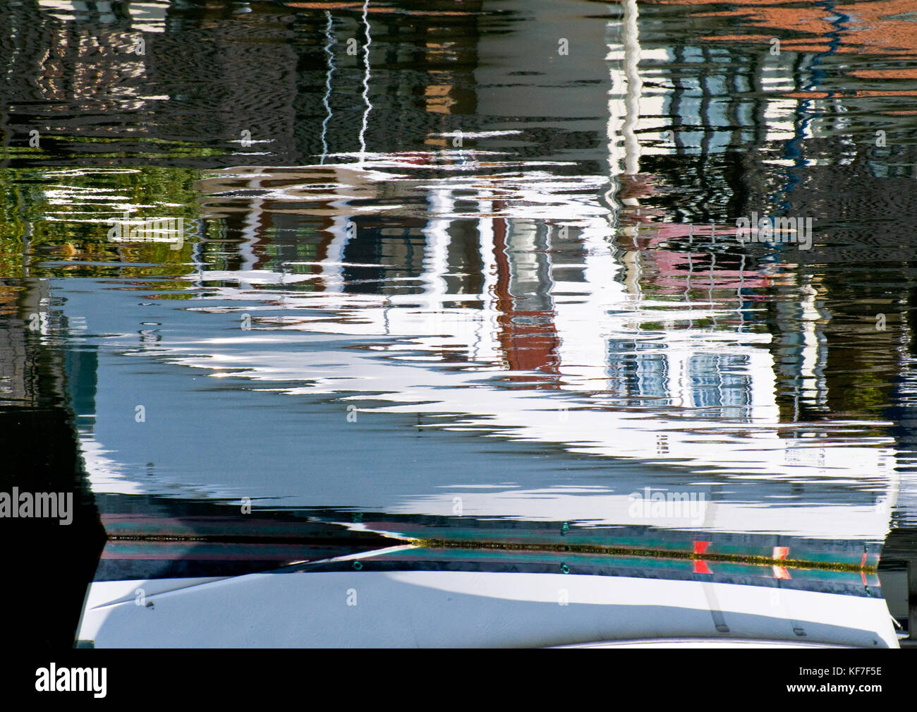 An abstract shot of a reflection of a boat at the marina Stock Photo ...