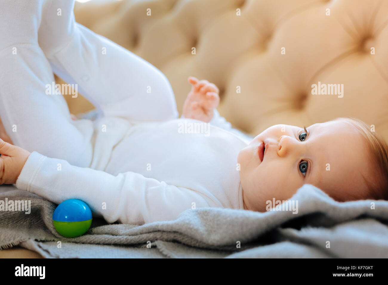 Calm little baby looking very quiet Stock Photo - Alamy