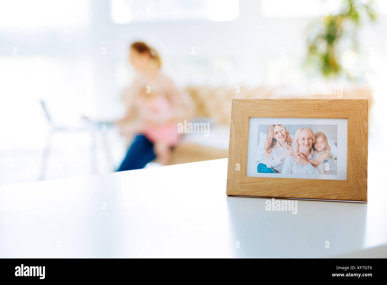 Adorable photo of close relatives standing on the table Stock Photo - Alamy