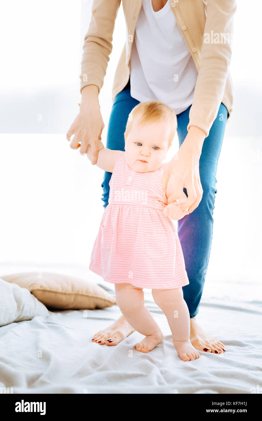Amazing first steps of a cute baby Stock Photo - Alamy