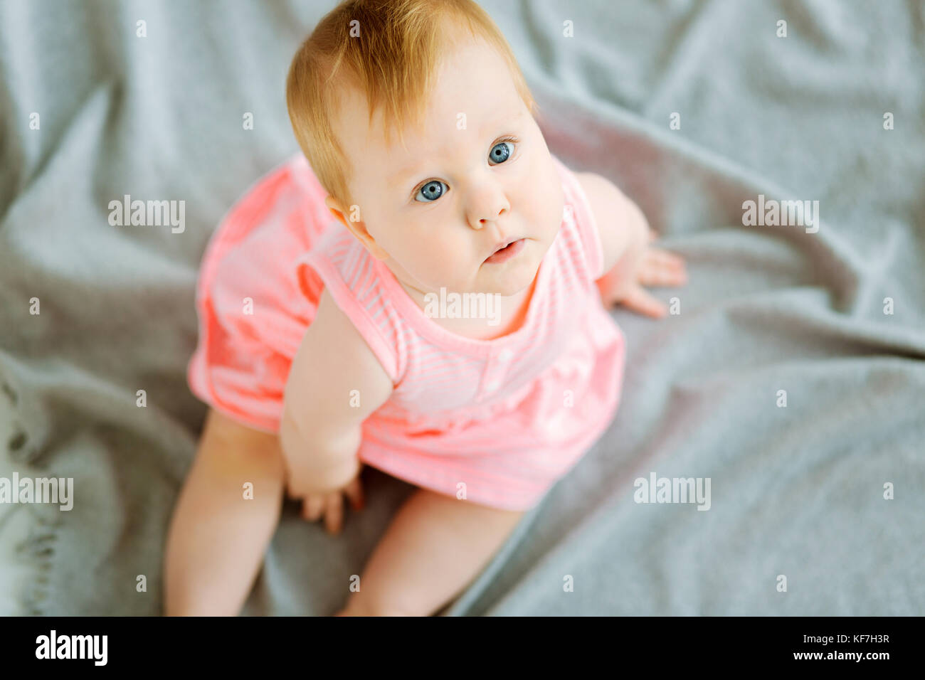 Adorable little girl looking up high Stock Photo - Alamy