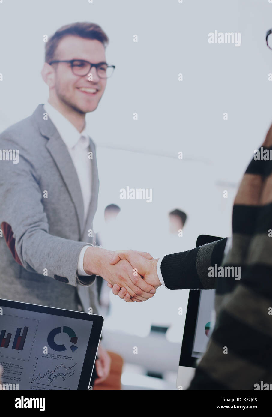 Business people closing a deal and handshaking at the office Stock ...