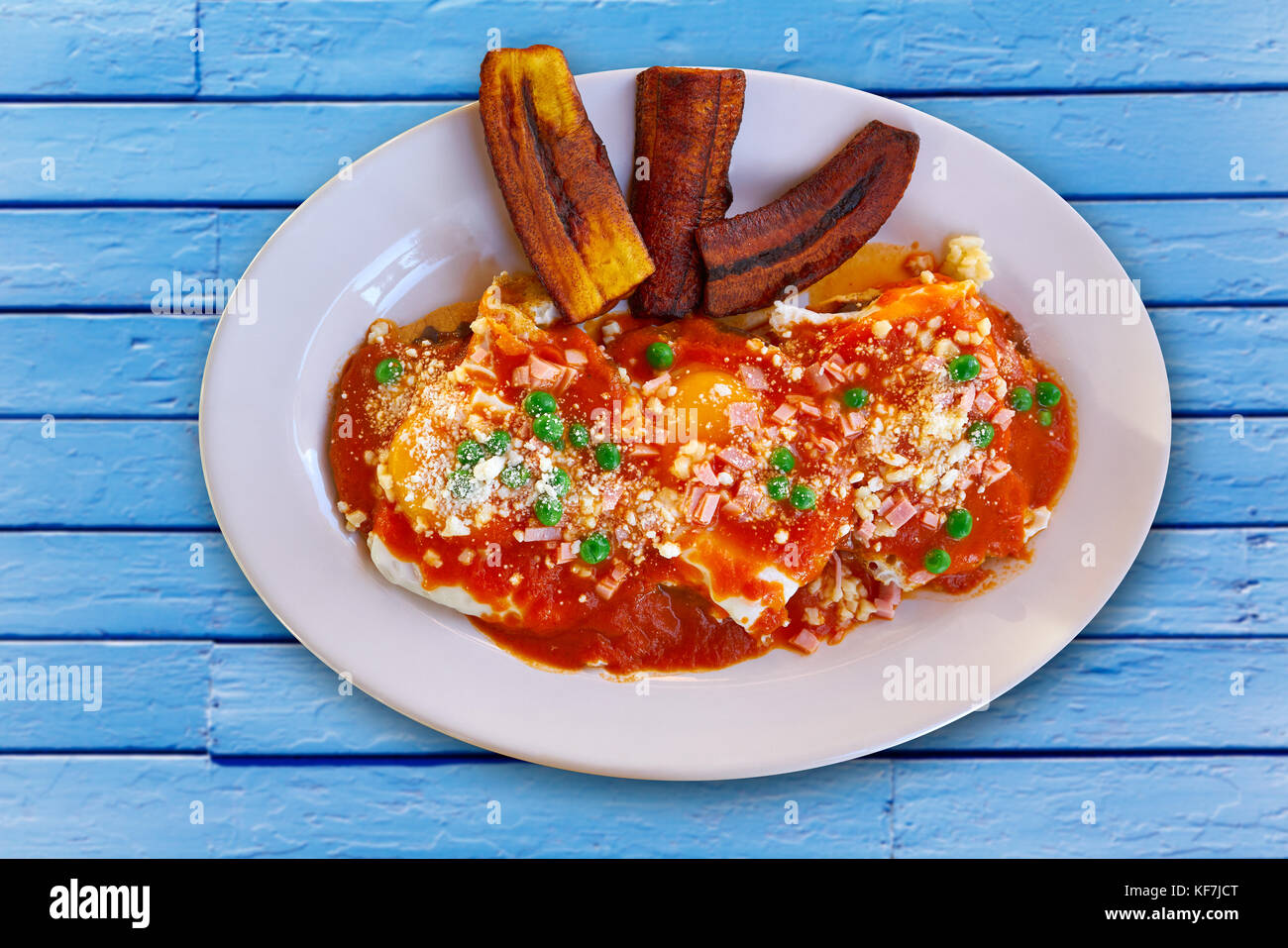Motulenos eggs breakfast of Mexico in Riviera Maya Stock Photo - Alamy
