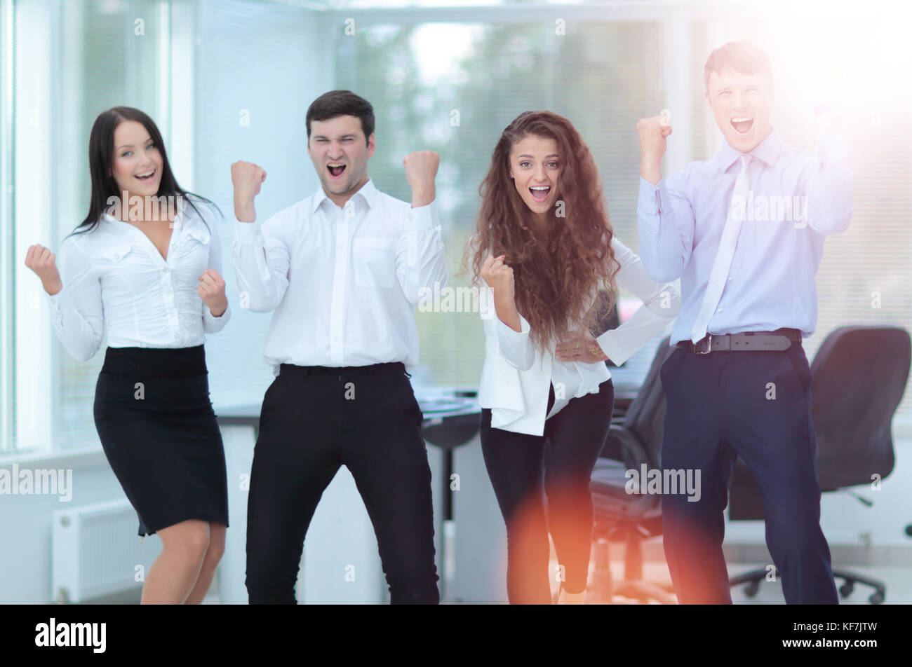 Successful and confident business team celebrating win Stock Photo - Alamy