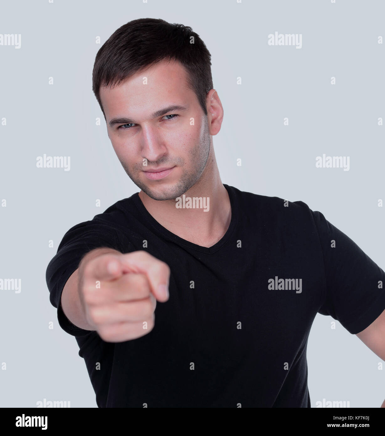 Portrait of a young man pointing his finger at you Stock Photo - Alamy