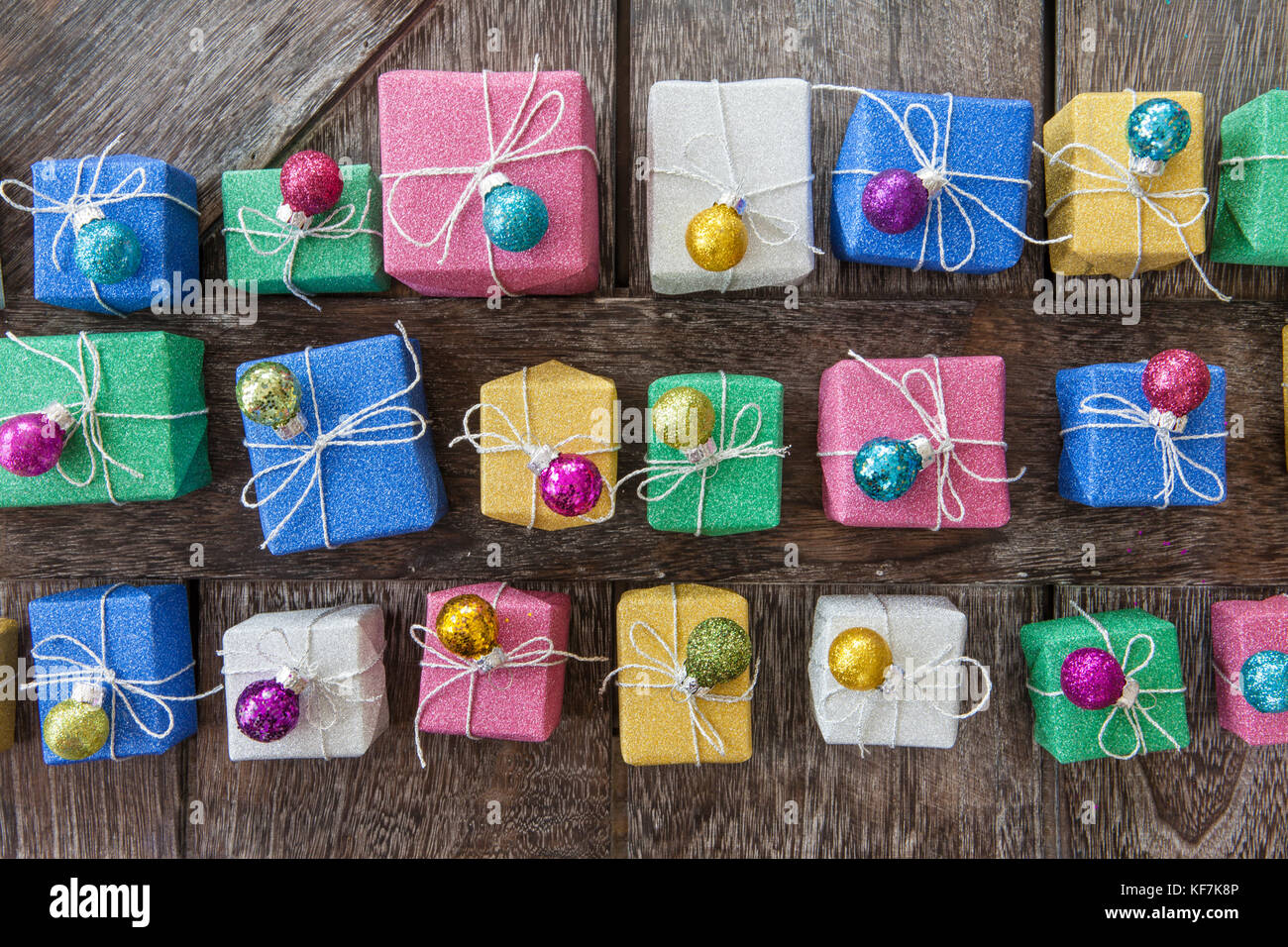 Little colorful gift boxes wrapped in glittery paper Stock Photo - Alamy