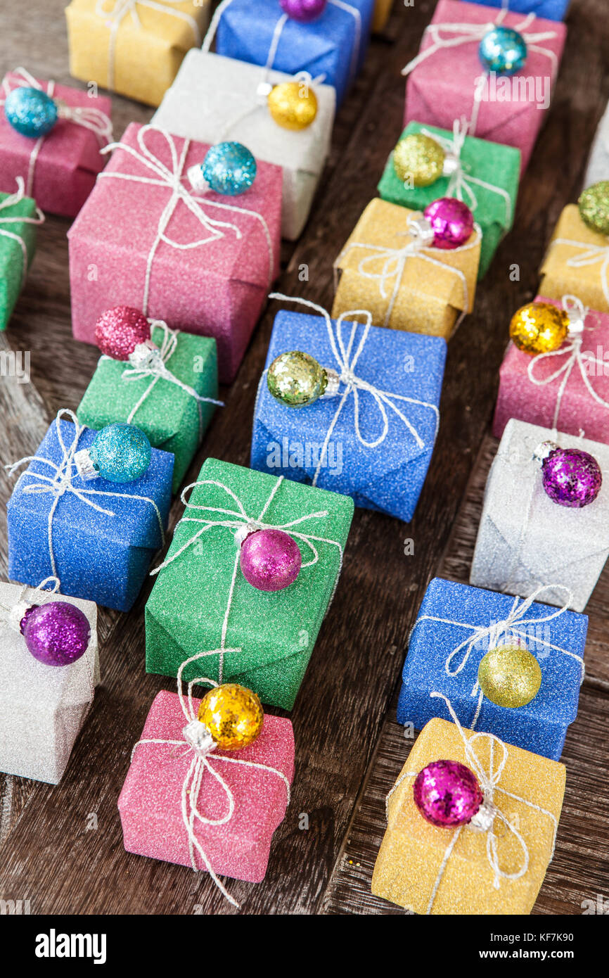 Little colorful gift boxes wrapped in glittery paper Stock Photo - Alamy