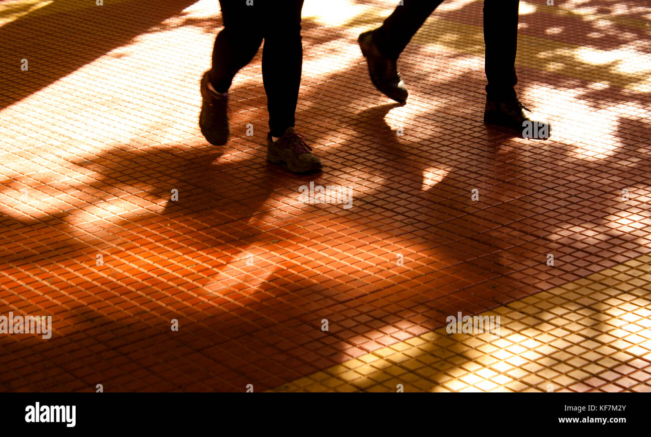 Shadows people walking on pavement hi-res stock photography and images ...