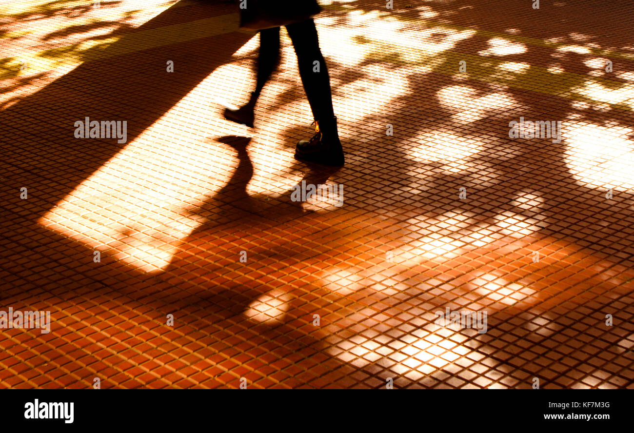 Shadows people walking on pavement hi-res stock photography and images ...