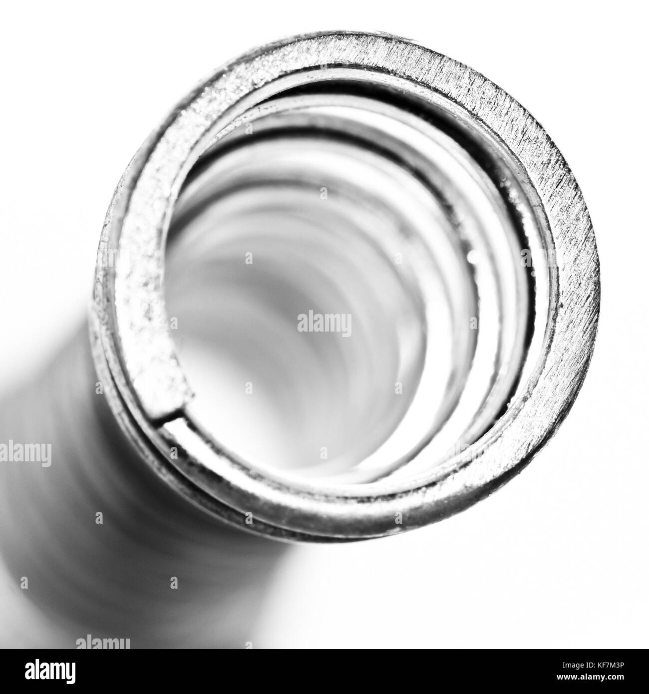 A macro shot of a coiled spring against a white background Stock Photo ...