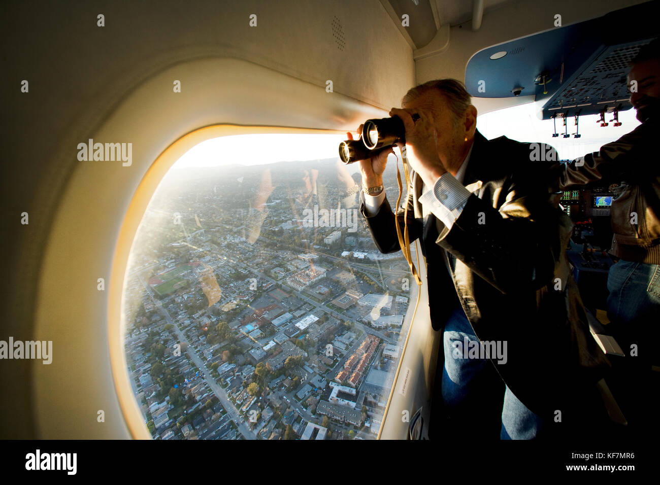 USA, California, San Francisco, man looking out the window of the ...