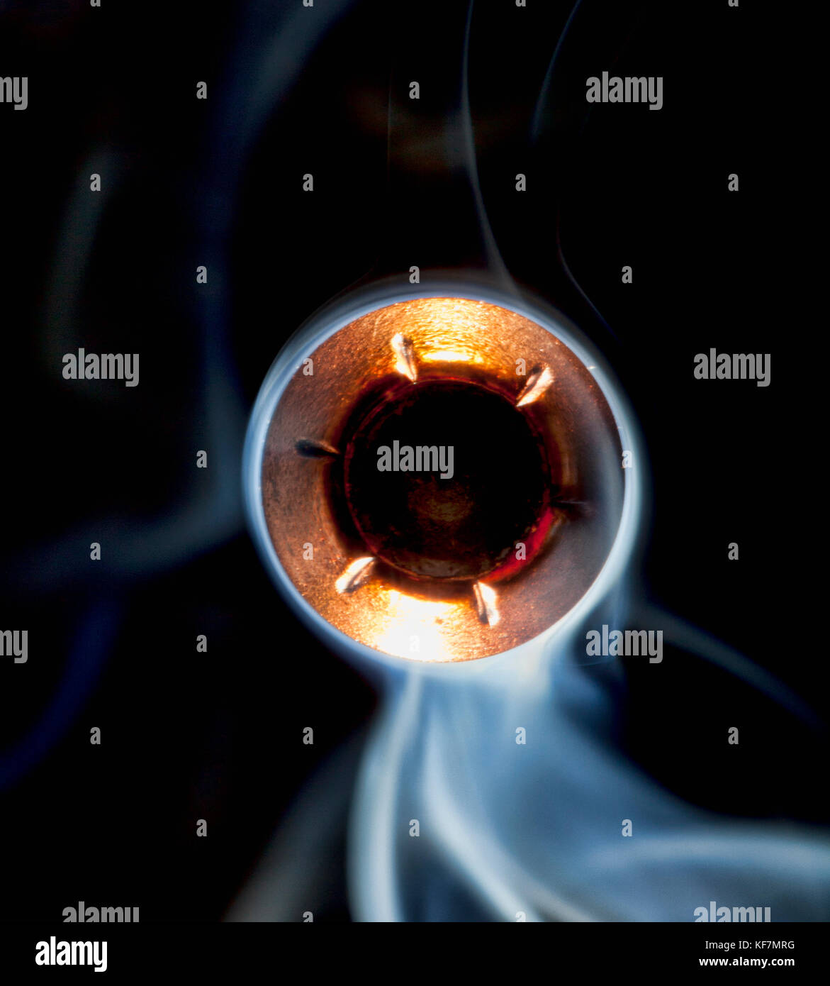 Hollow point bullet and smoke coming at the camera Stock Photo - Alamy