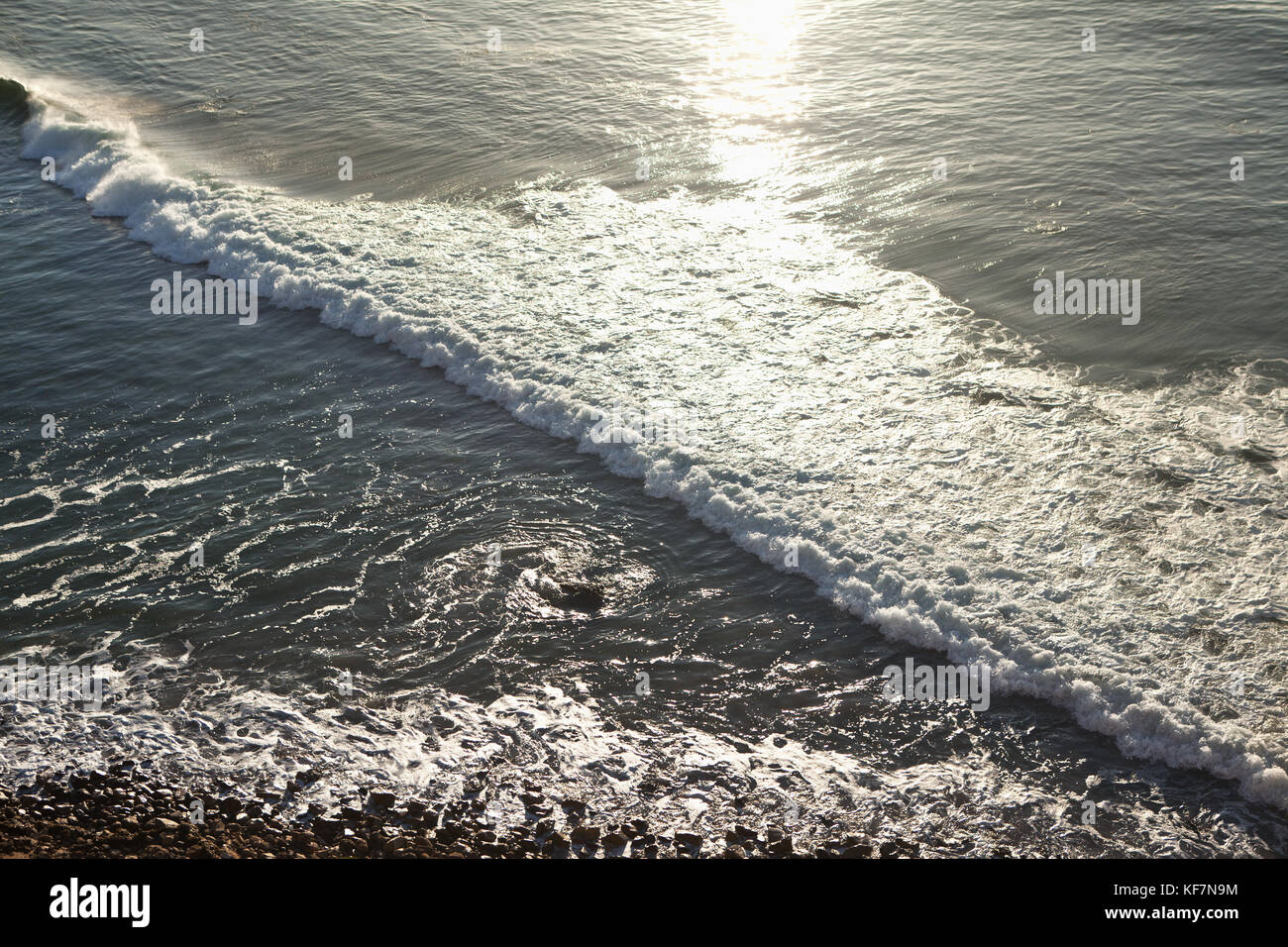 USA, California, Malibu, birds eye view of a wave breaking at Big Dume ...