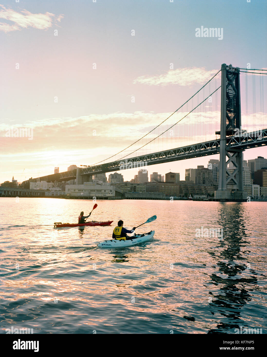 USA, California, San Francisco, a man and woman kayak in the San ...