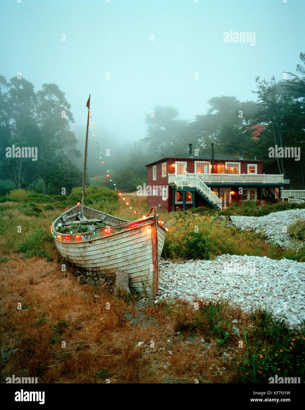 USA, California, Tomales Bay, Nick's Cove, a boat and oyster shells are ...