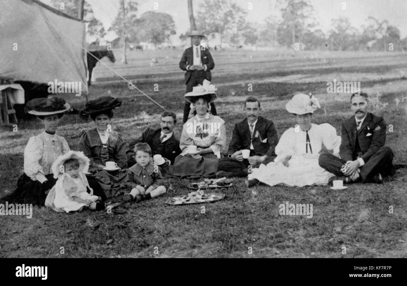 This photograph depicts a family gathered along the Brisbane River in ...