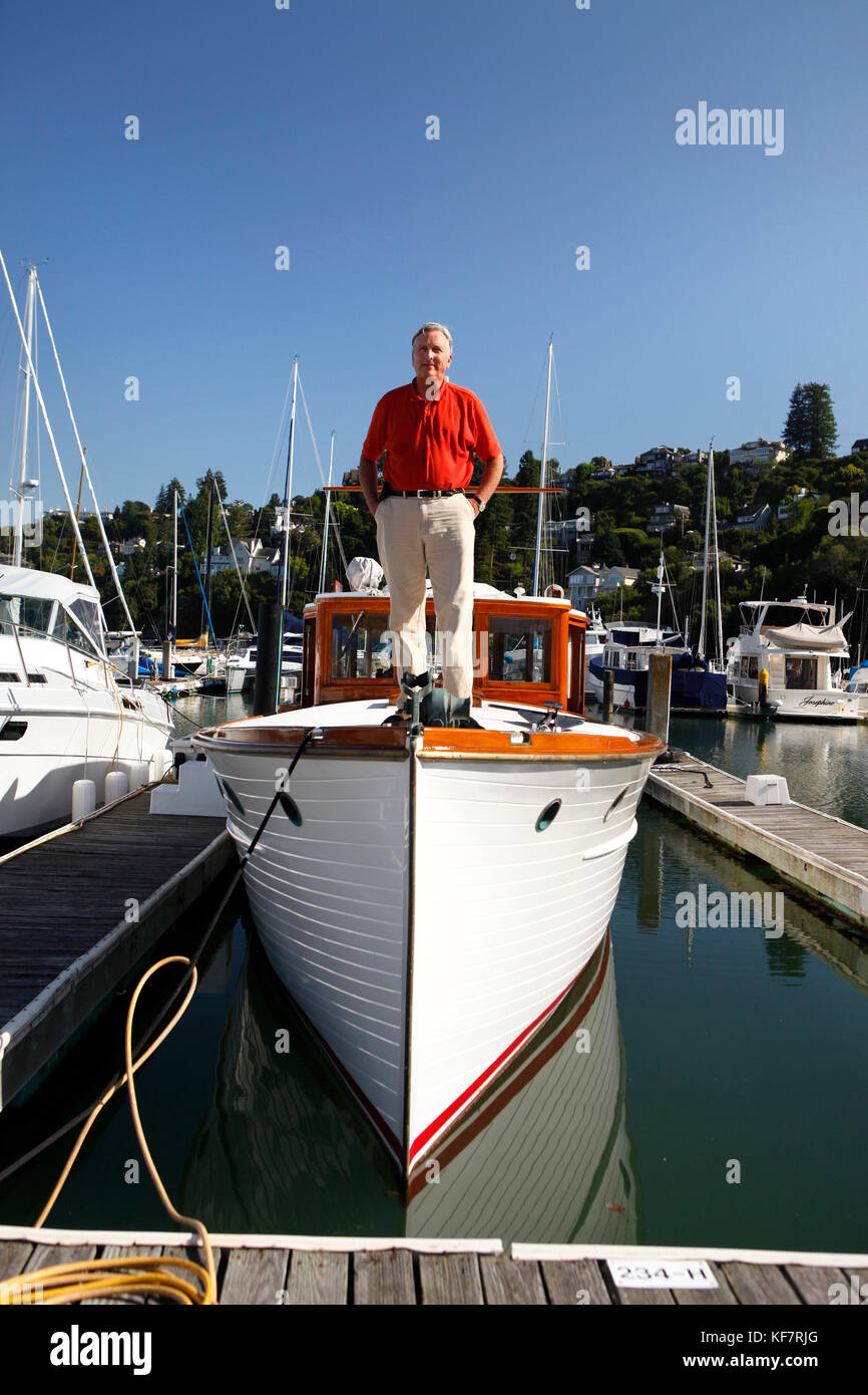 USA, California, San Francisco, Peter Johnson stands on the bow of his ...