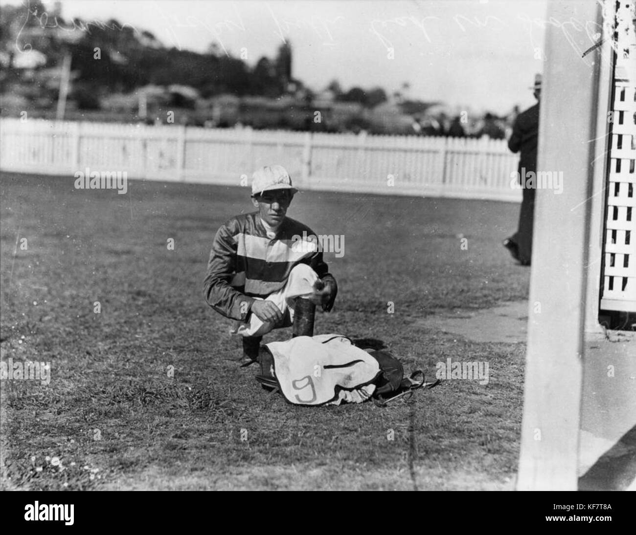 1 104512 Jockey Jim Gorman is putting lead in his saddle before a race ...