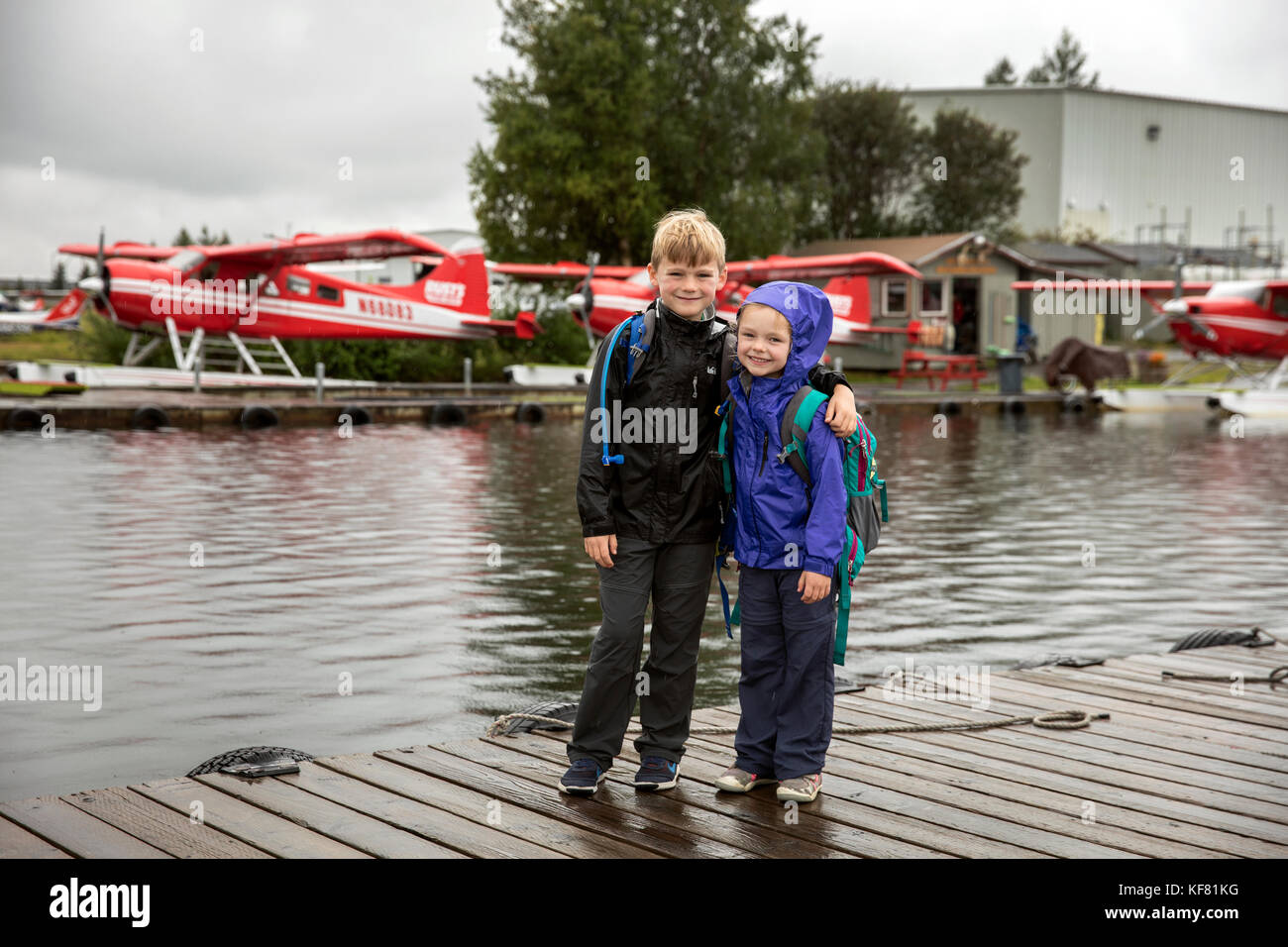 USA, Alaska, Anchorage, loading Rusts Flying Service float plane from ...