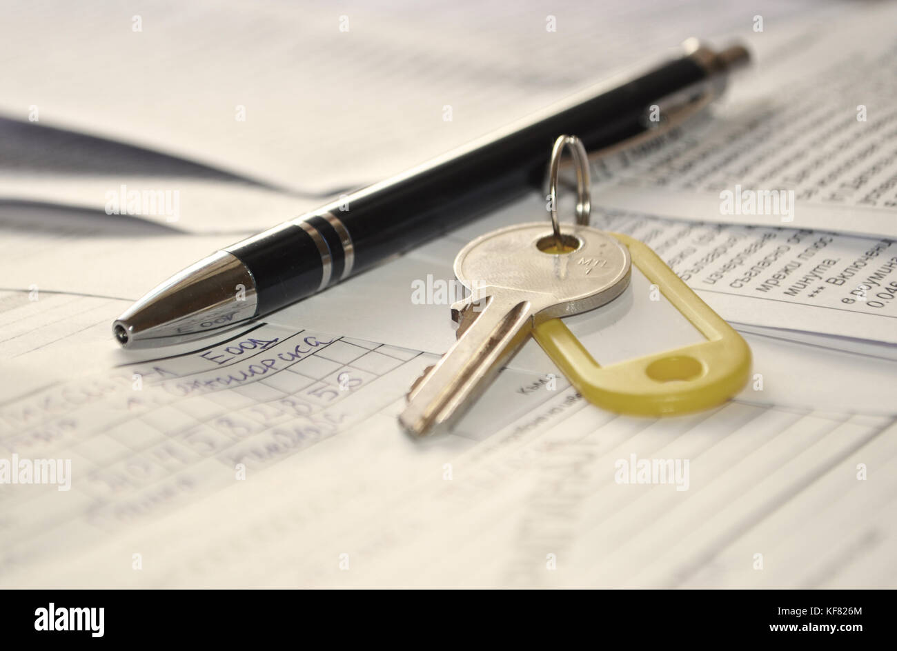 A key holder on pile of documents Stock Photo - Alamy